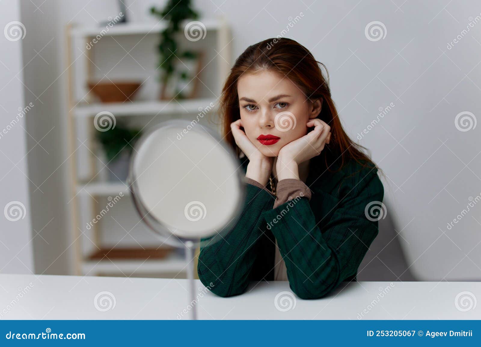 A Sad, Brooding, Tired Young Red-haired Woman at the Table is Thinking ...