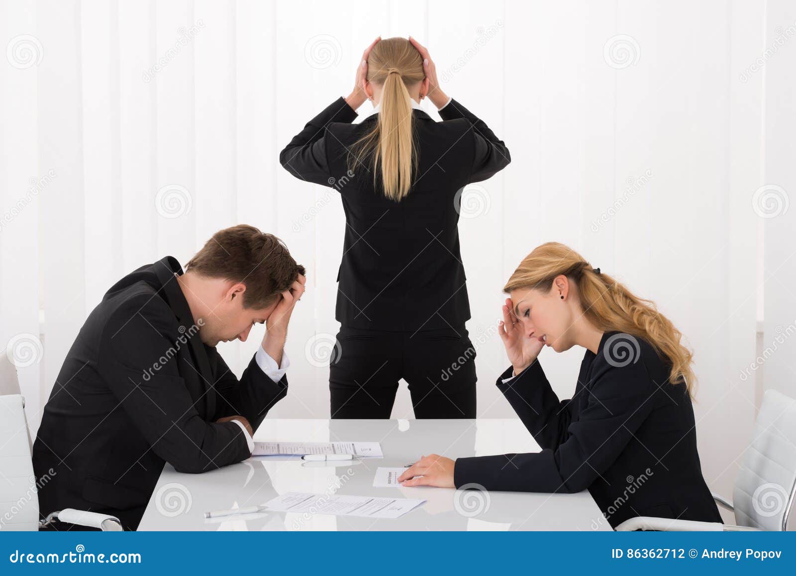 Sad Businesspeople in Office Stock Photo - Image of paper ...