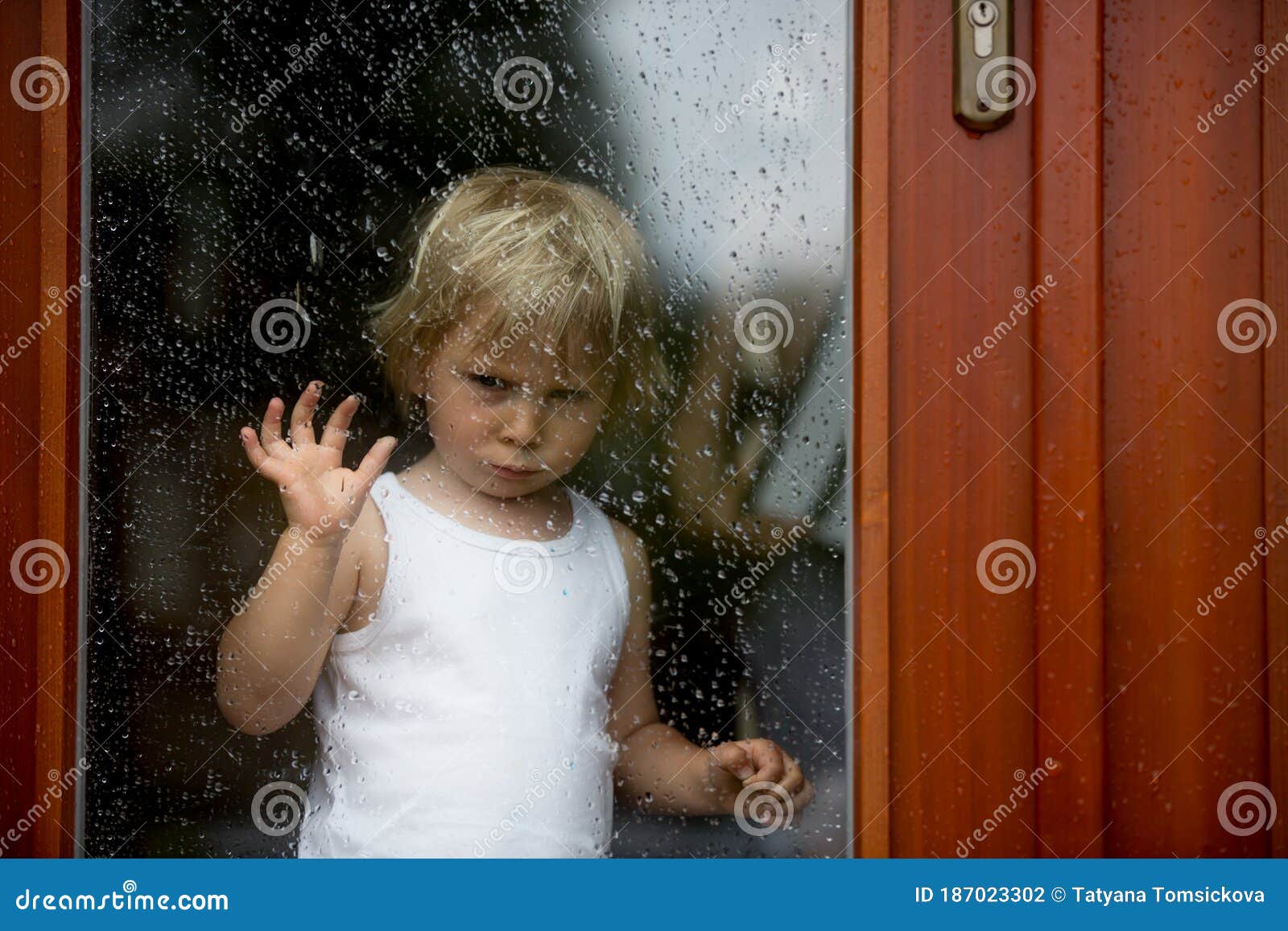 Sad Child Behind the Window on Rainy Day Stock Photo - Image of ...