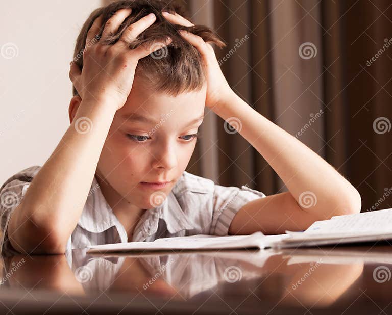 Sad child doing homework stock image. Image of homework - 47073169