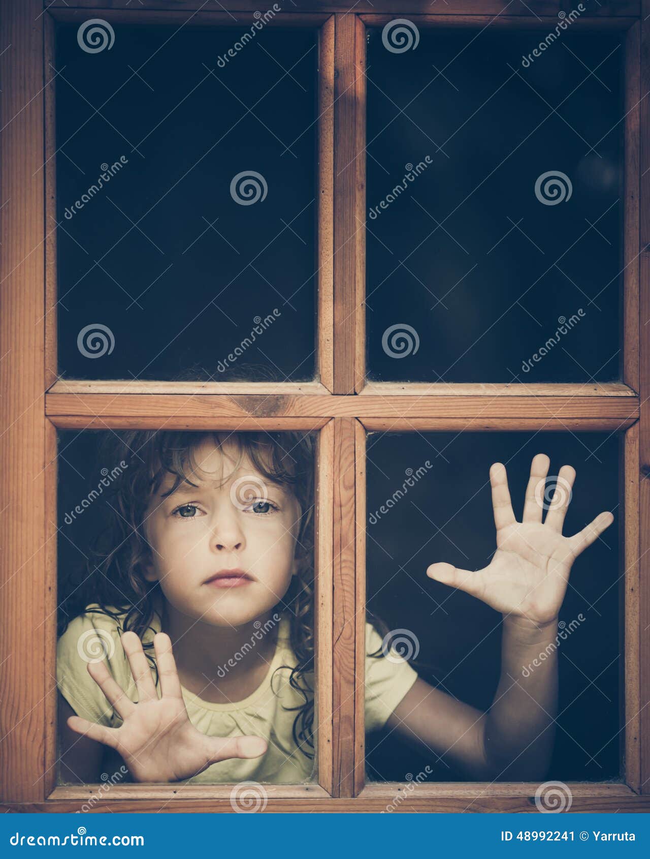 Child Looking Out A Window