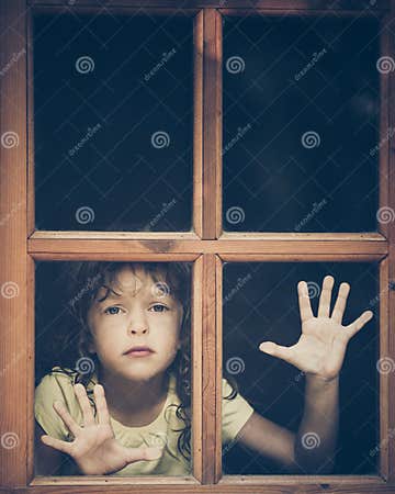 Sad Child Looking Out the Window Stock Image - Image of childhood ...