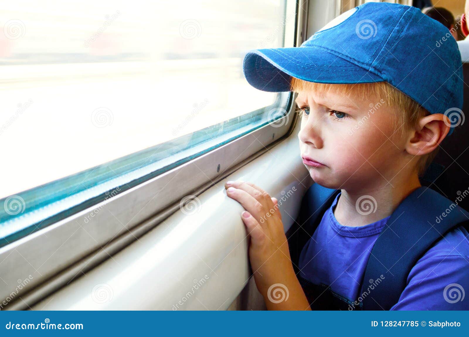 Sad Child in the Train stock image. Image of sadness - 128247785