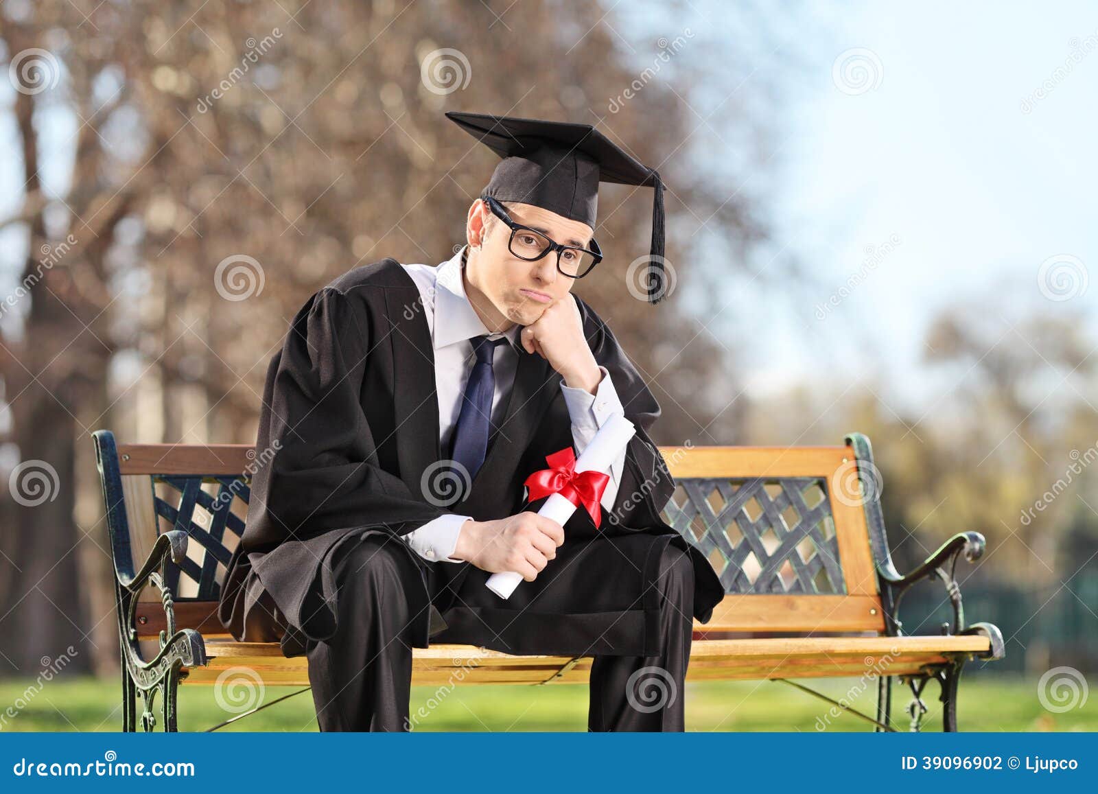 Sad College Student Sitting on a Bench in Park Stock Photo - Image of ...