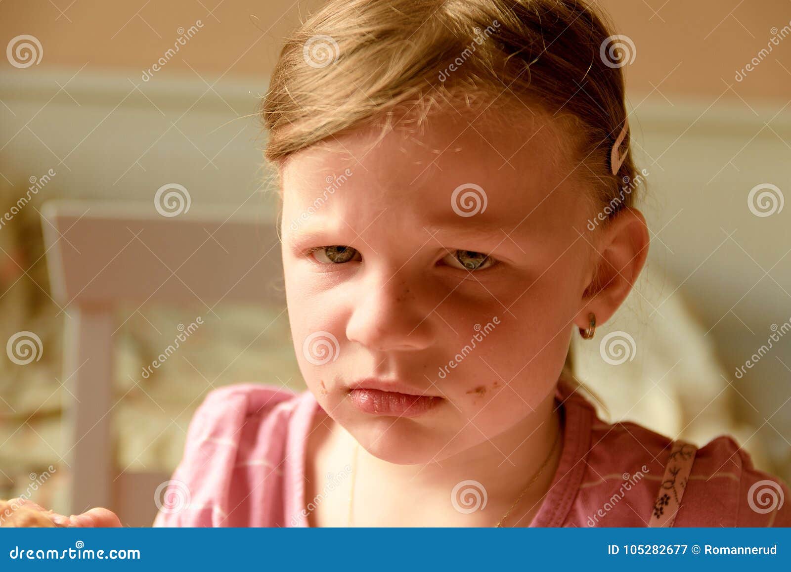A Sad Cute Small Girl A Small Girl Looks Sadly A Small Girl Sits In The Kitchen Stock Image
