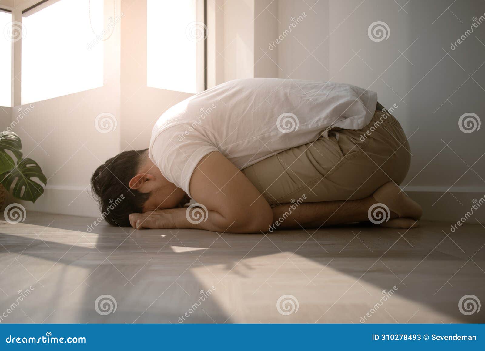 Sad and Depressed Man Hugging Himself Down on the Floor. Stock Image ...