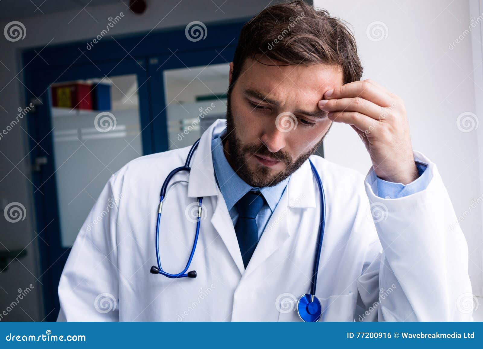 Sad Doctor Standing in Corridor Stock Photo - Image of indoors ...