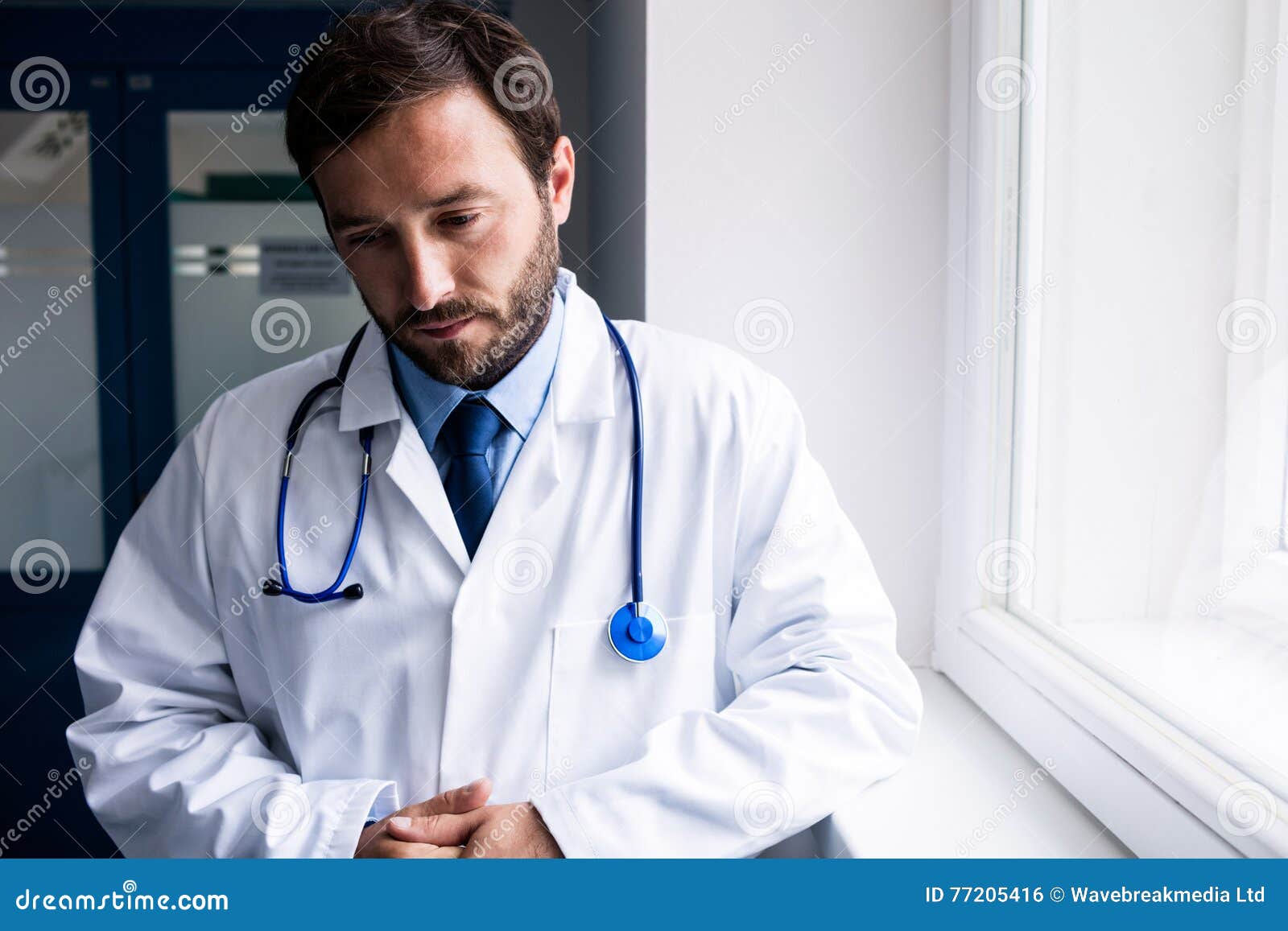 Sad Doctor Standing in Corridor Stock Photo - Image of health ...