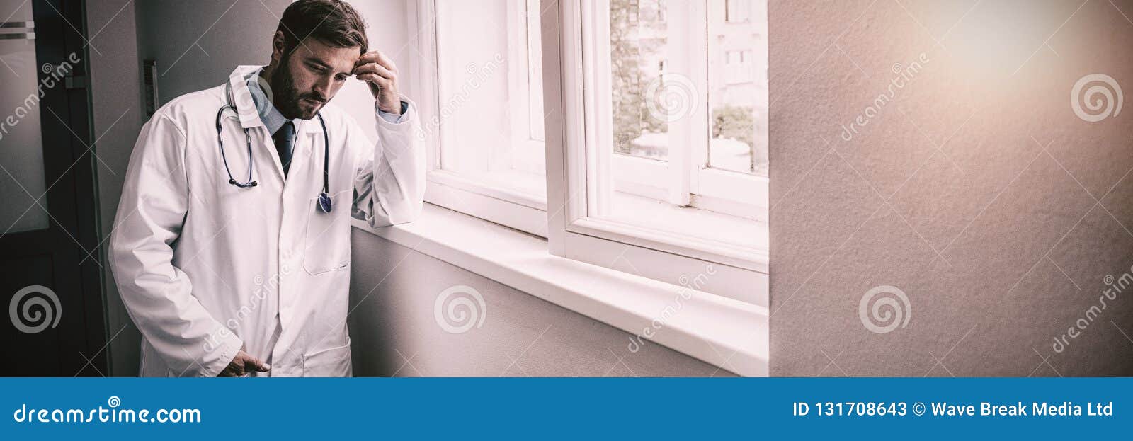 Sad Doctor Standing in Corridor Stock Image - Image of office, forehead ...