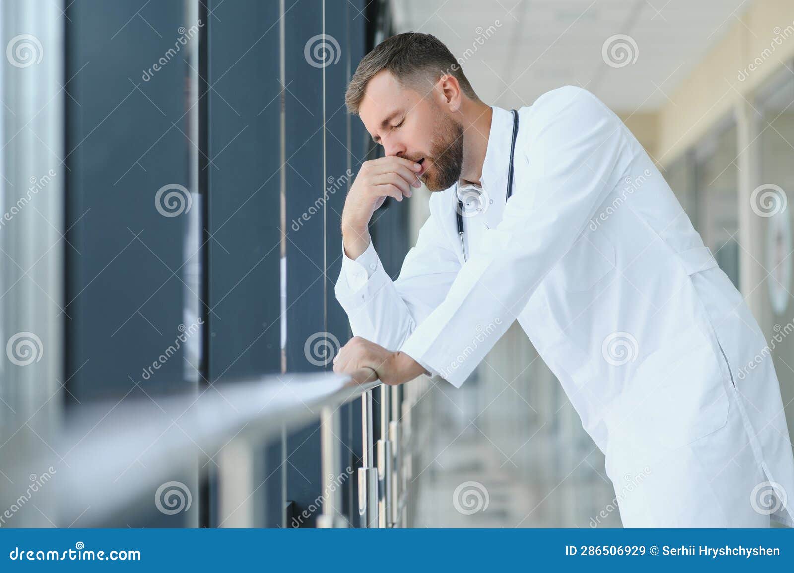 Sad Doctor Standing in Hospital Corridor Stock Image - Image of ...