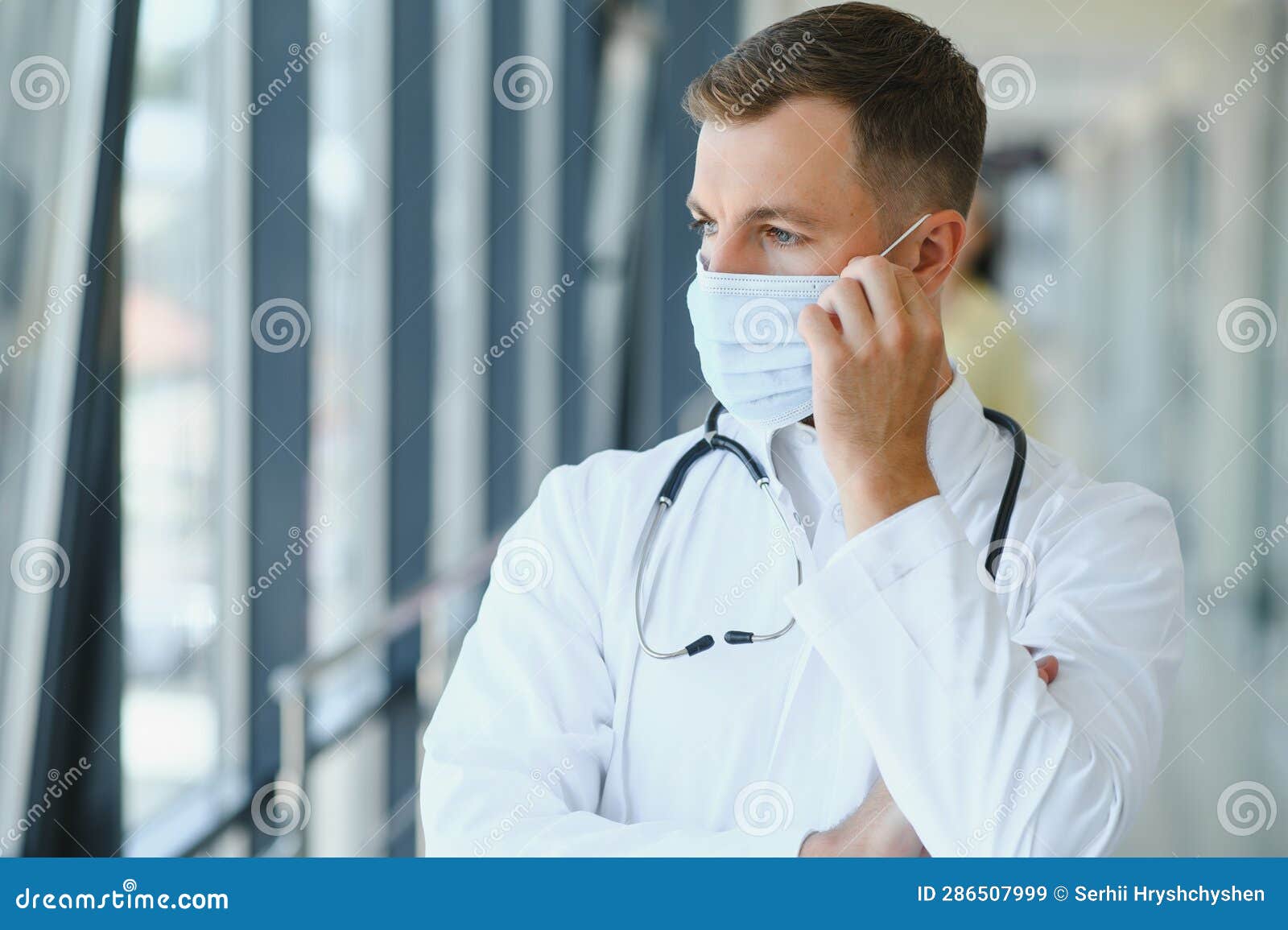 Sad Doctor Standing in Hospital Corridor Stock Image - Image of clinic ...