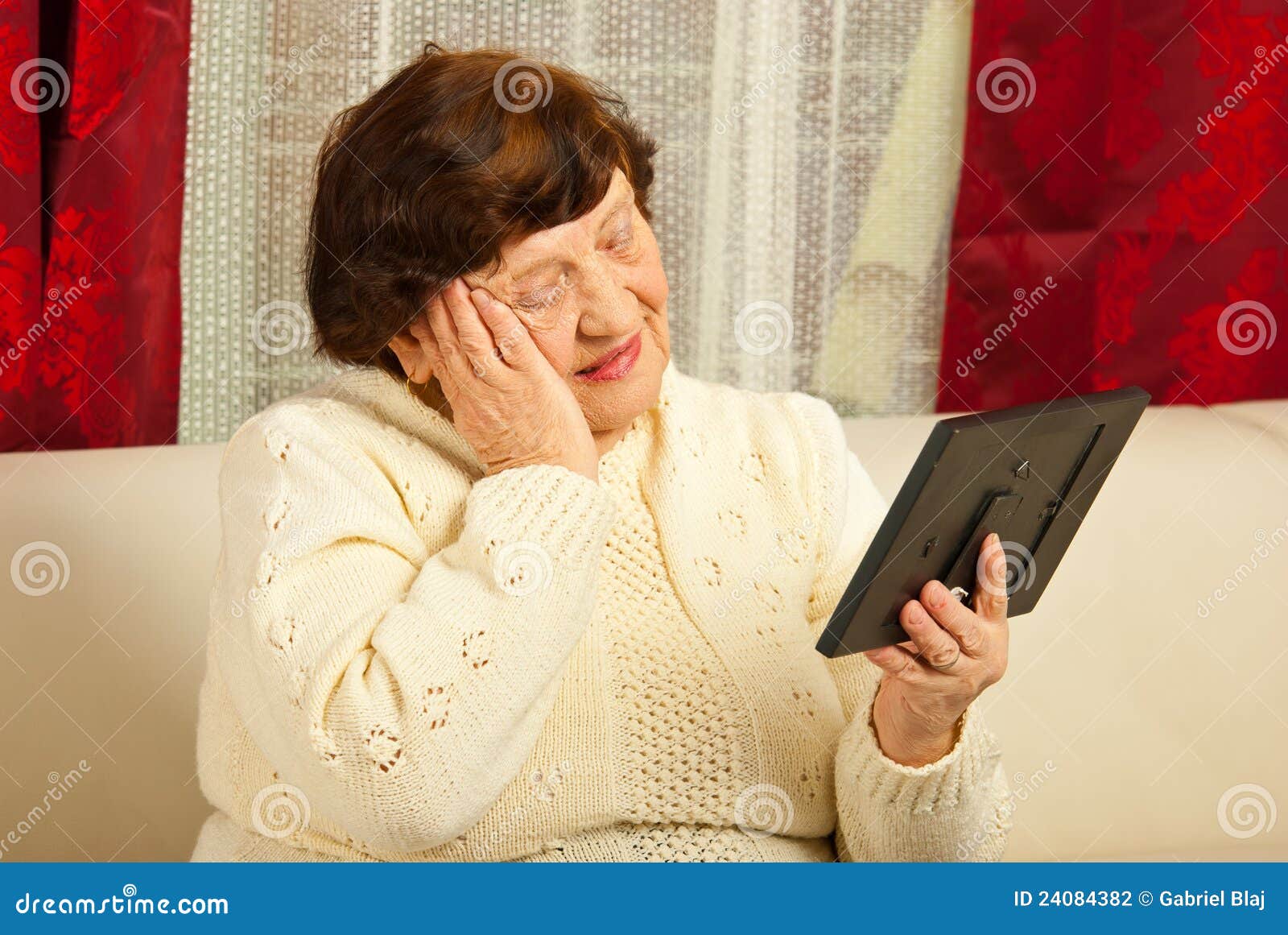 Sad Elderly Woman Looking at Photo Frame Stock Photo - Image of holding ...