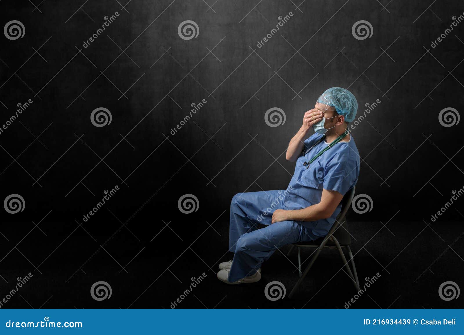 Sad, Exhausted Doctor Sitting in a Dark Room Stock Image - Image of ...