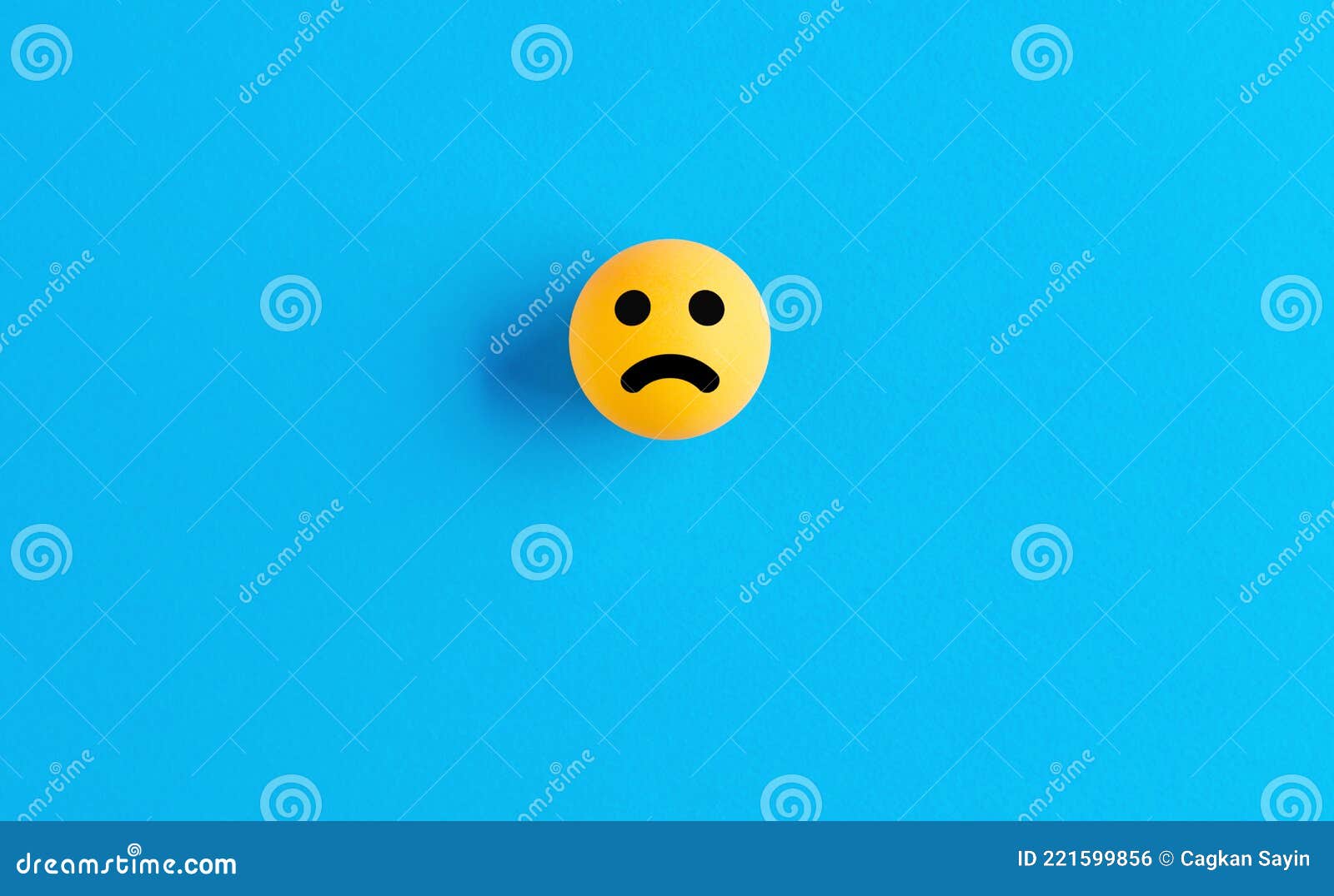Sad Face Emoticon Or Icon On A Ball On Blue Background. Negative ...