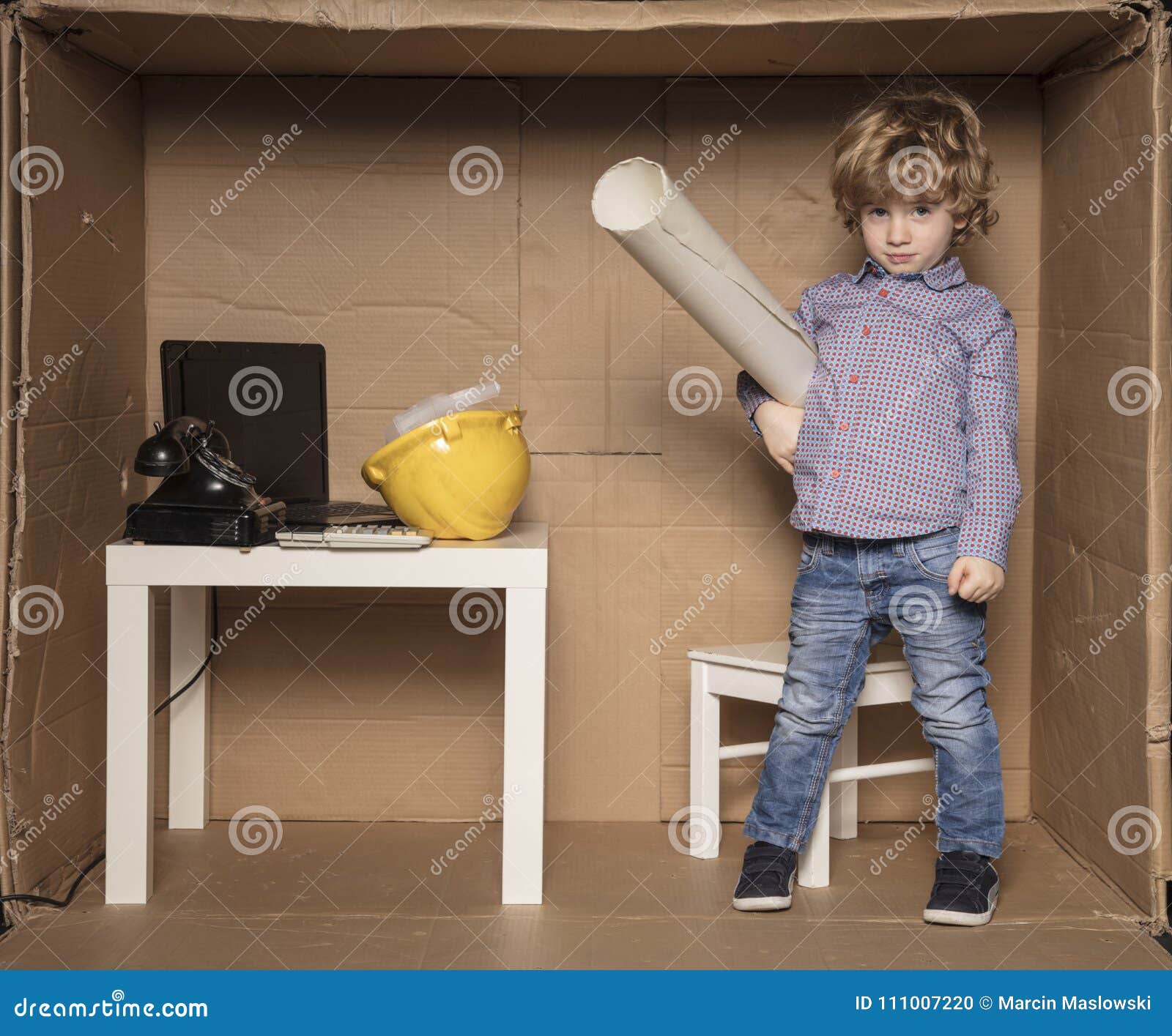 Sad Face of a Small Engineer, Plans for Building in Hand Stock Photo ...