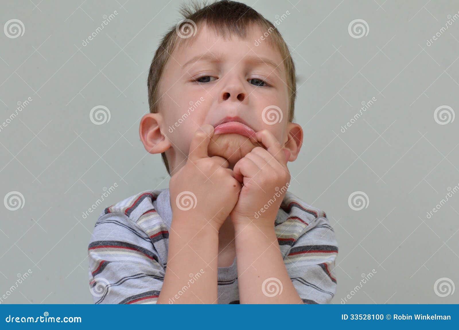Sad faced boy stock photo. Image of pouting, silly, finger - 33528100