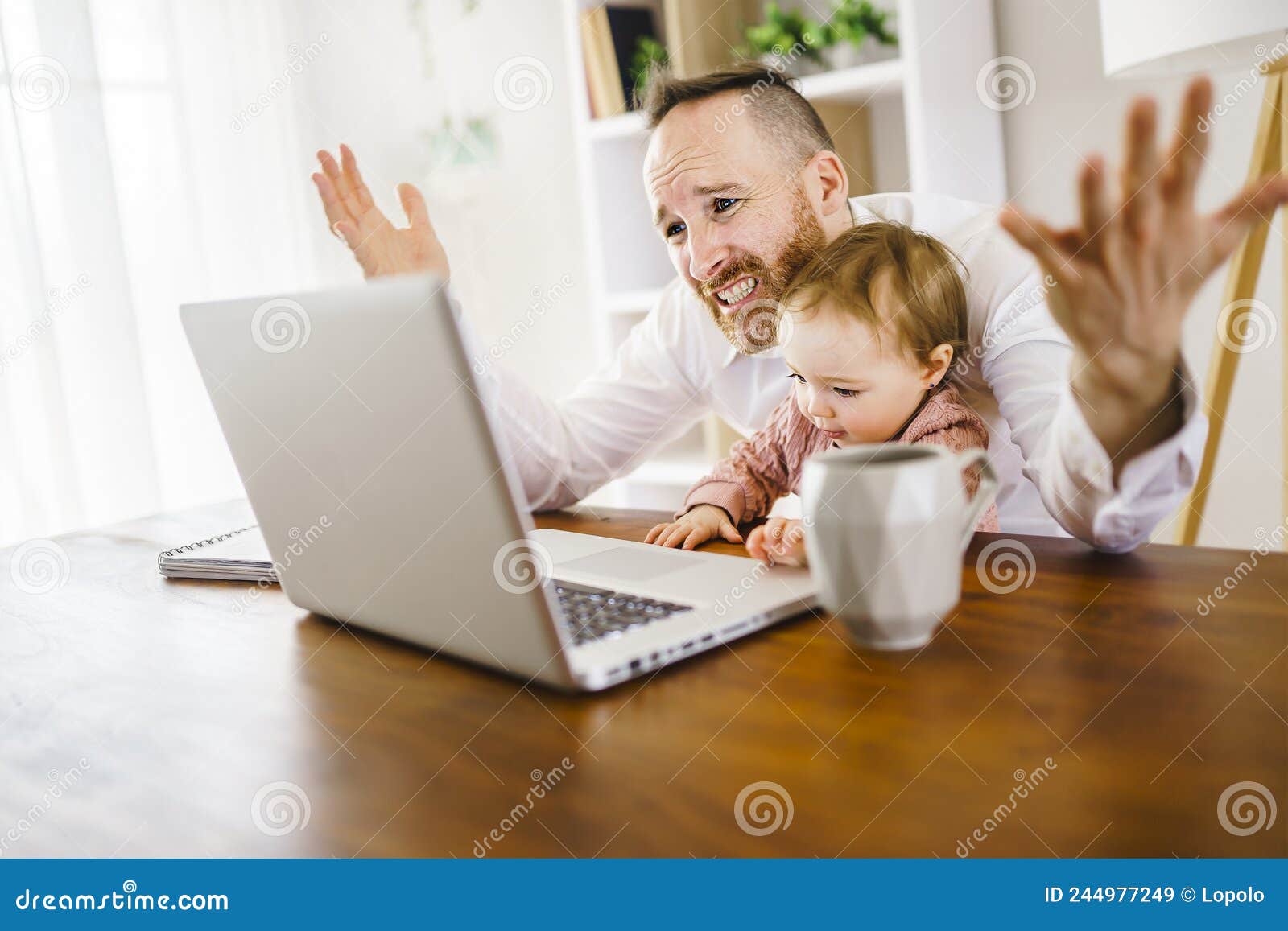 Sad and Frustrated Father in Kitchen Home Office with Computer and Her ...