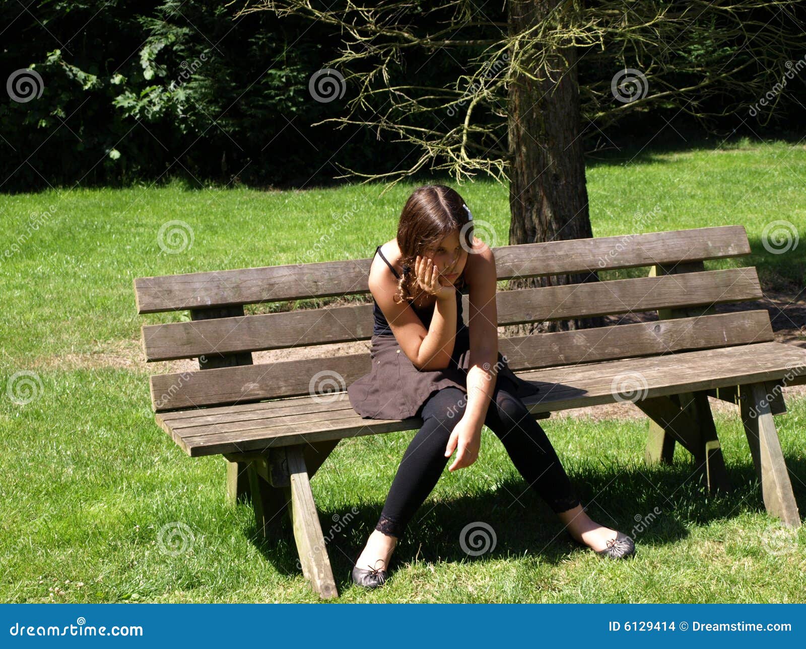 Sad girl on bench stock photo. Image of little, grass - 6129414