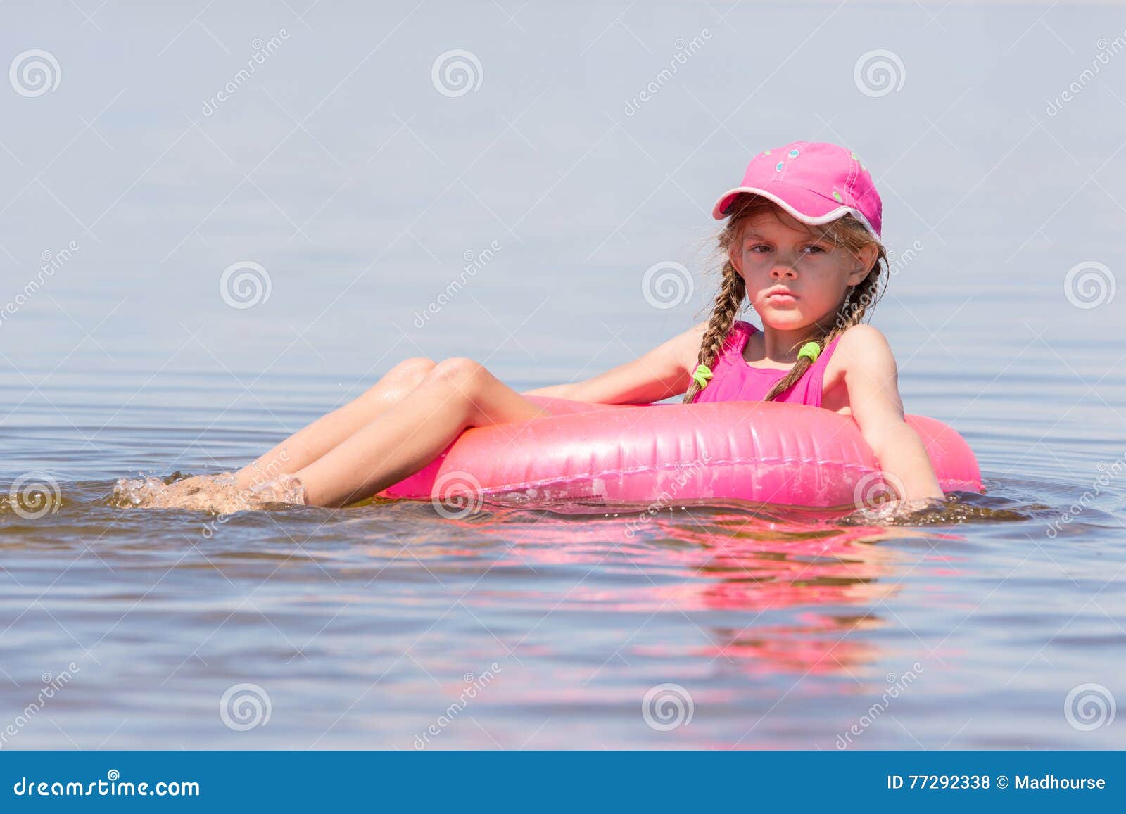 Sad Girl in a Cap Floating in River Sat on the Swimming Circle Stock ...