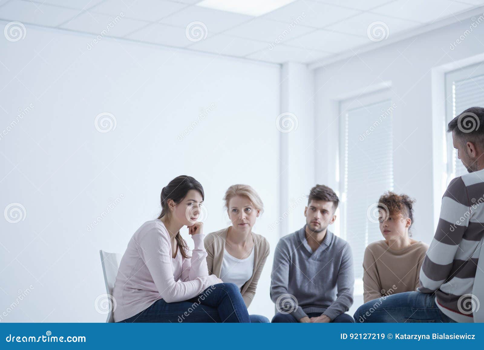 Sad girl in a group stock image. Image of patient, circle - 92127219