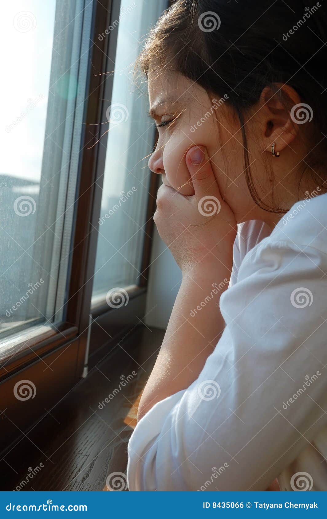 Sad girl near a window stock photo. Image of kids, upset - 8435066