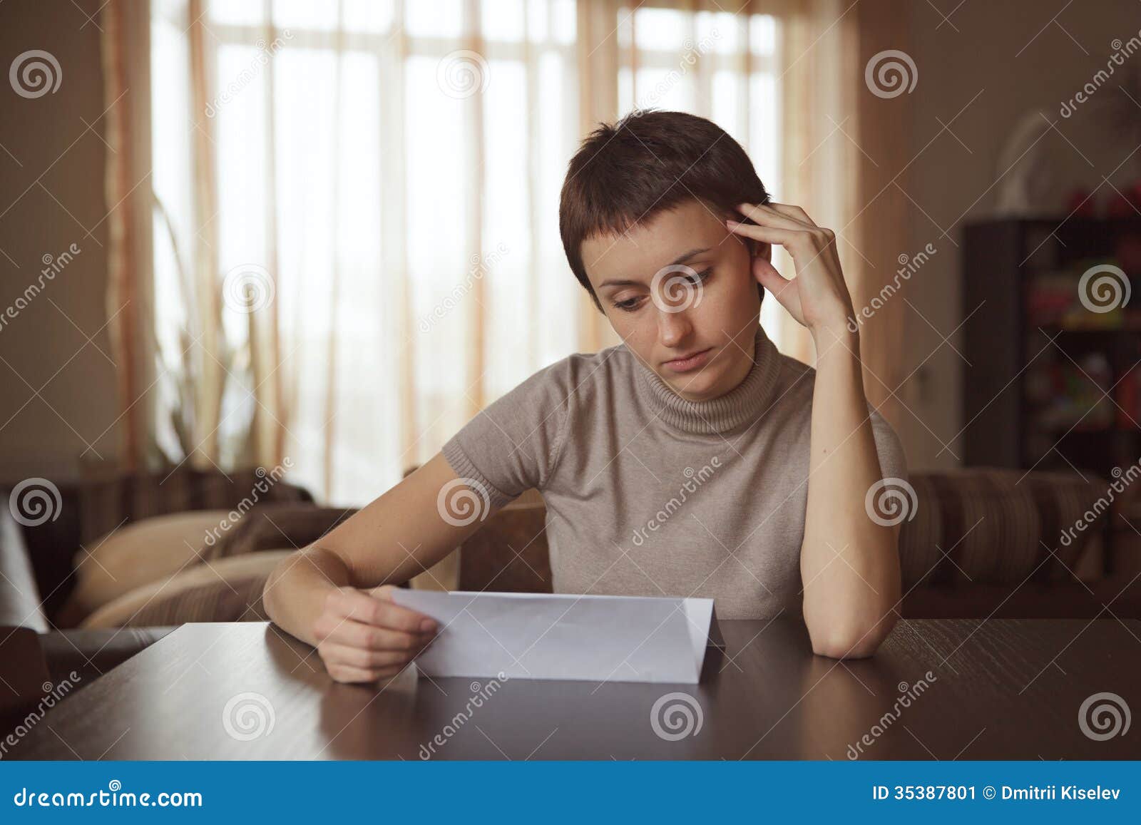 Sad girl reading a letter stock image. Image of home - 35387801