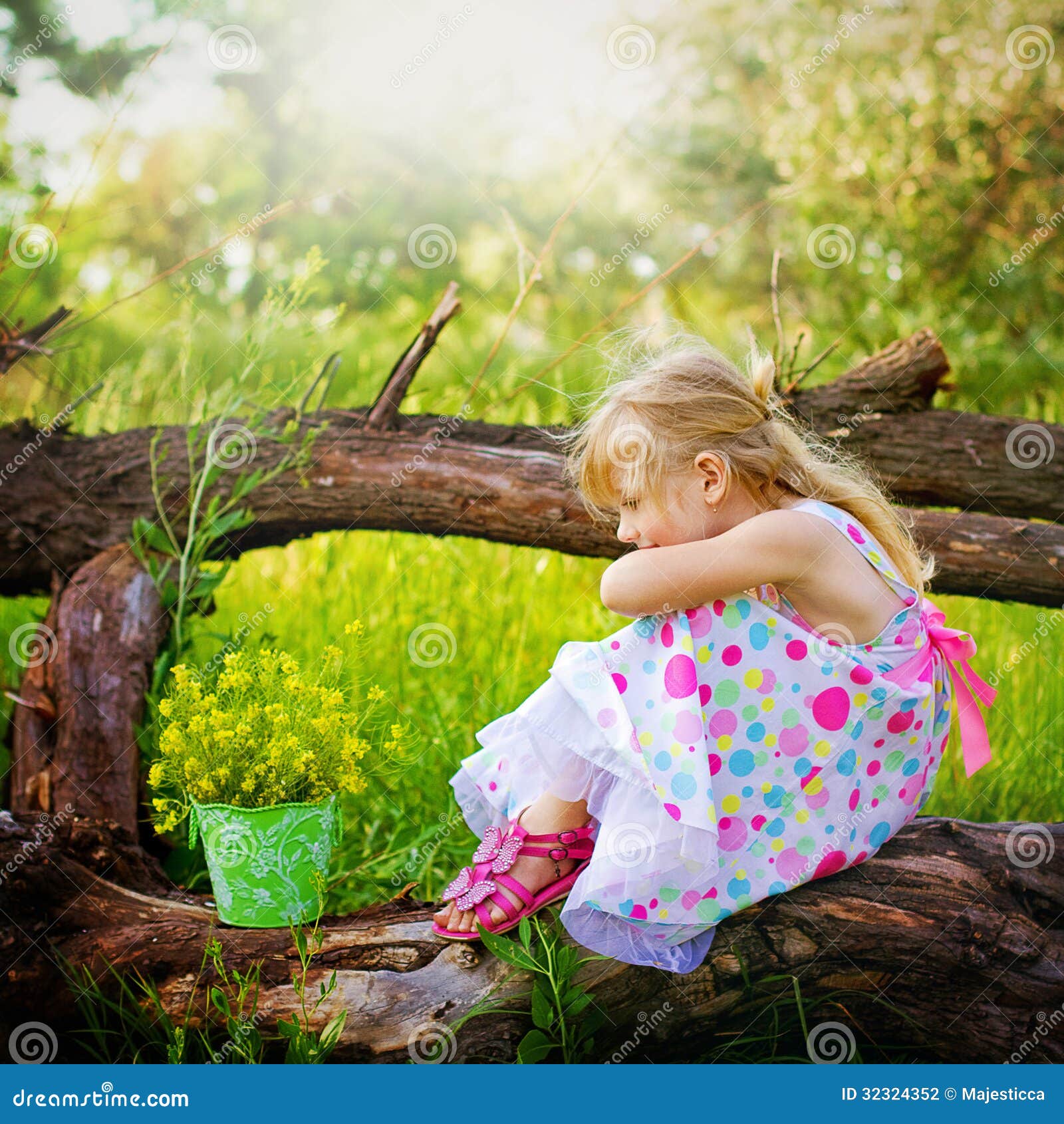 Sad Girl Sitting on a Tree Branch in a Summer Park Stock Photo - Image ...