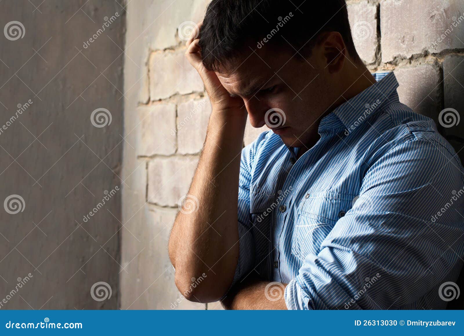 Sad guy against wall stock photo. Image of depressed - 26313030