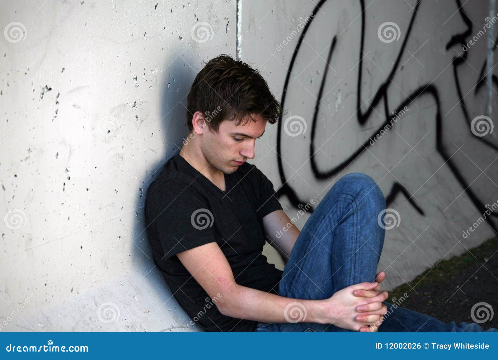 Sad guy and graffitti stock photo. Image of outside, alone - 12002026