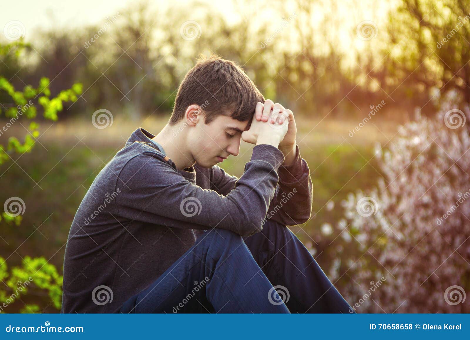Sad Guy Sitting on the Ground Stock Photo - Image of green, solitude ...