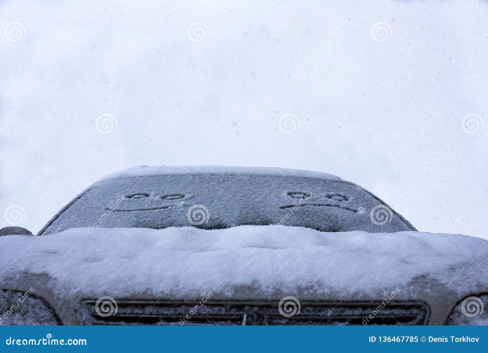 The Sad and the Happy Smile on the Snowy Windshield of a Car Stock ...