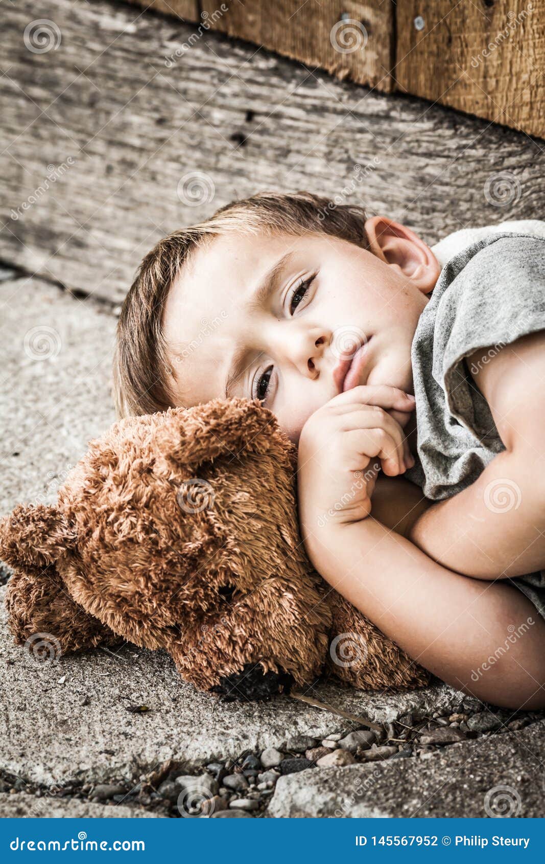 Sad Homeless Boy stock photo. Image of face, hurt, person - 145567952