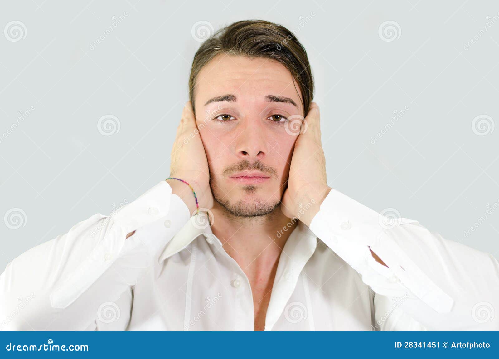 Sad or Irritated Young Man Covering His Ears with Hands Stock Image ...