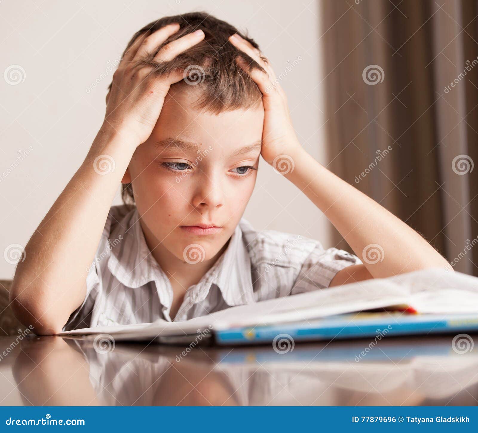 Sad kid doing homework stock photo. Image of sitting - 77879696