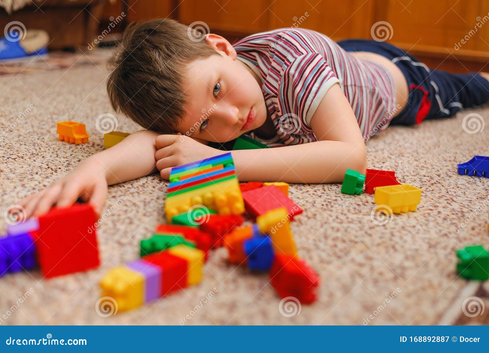 Sad Kid Near the Fallen Tower from the Constructor Stock Image - Image ...