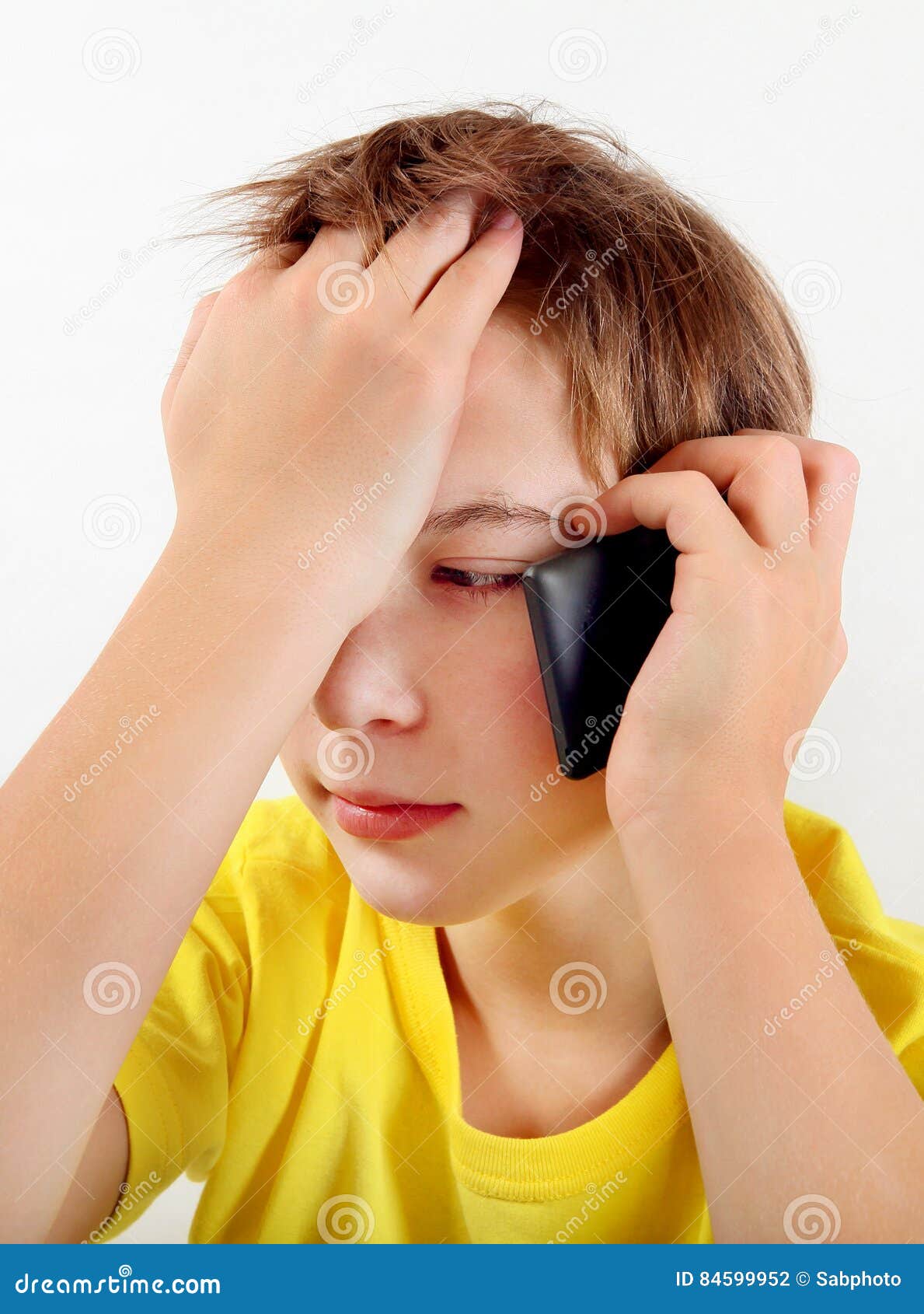 Sad Kid with a Phone stock photo. Image of sadness, phone - 84599952