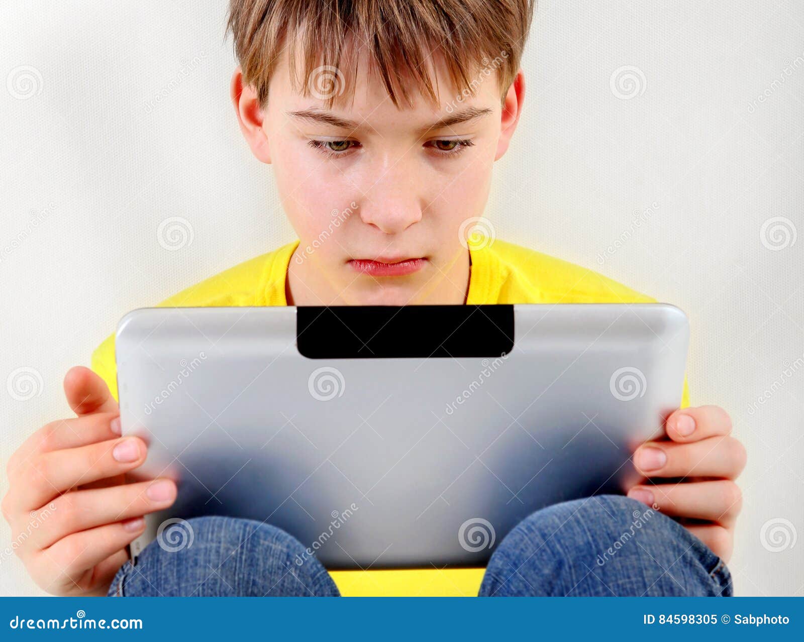 Sad Kid with Tablet Computer Stock Image - Image of serious, boyhood ...