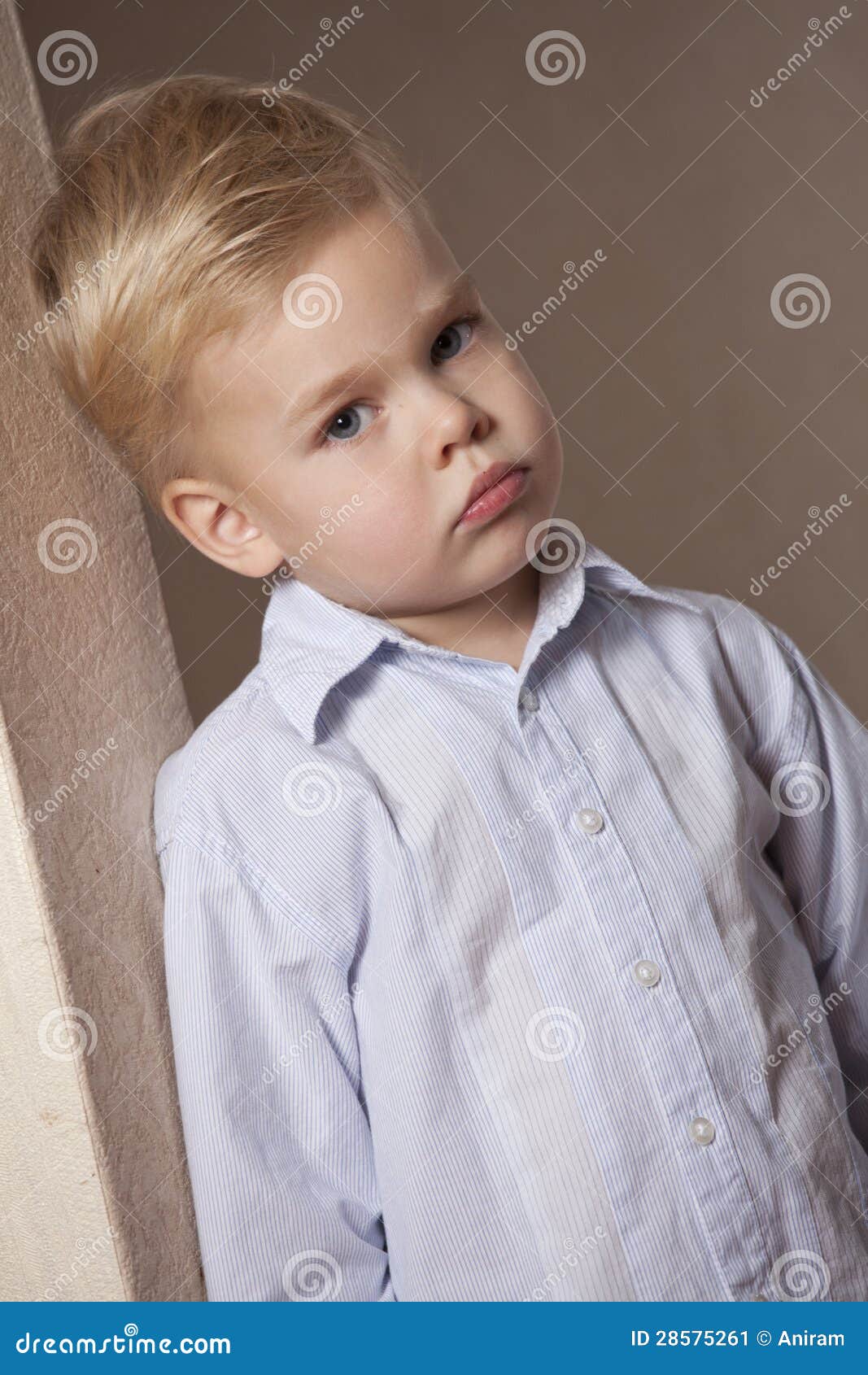 Sad little boy stock image. Image of expression, shirt - 28575261