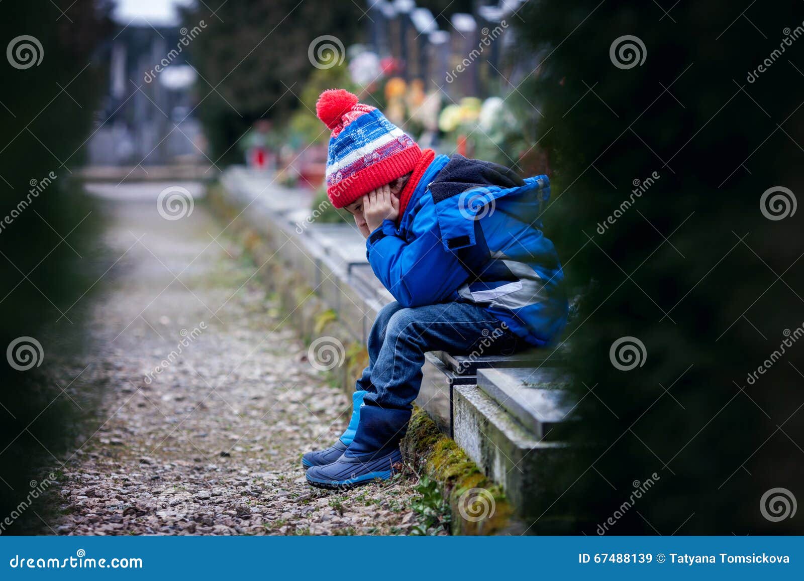 Sad Little Boy, Sitting on a Grave in a Cemetery Stock Image - Image of ...