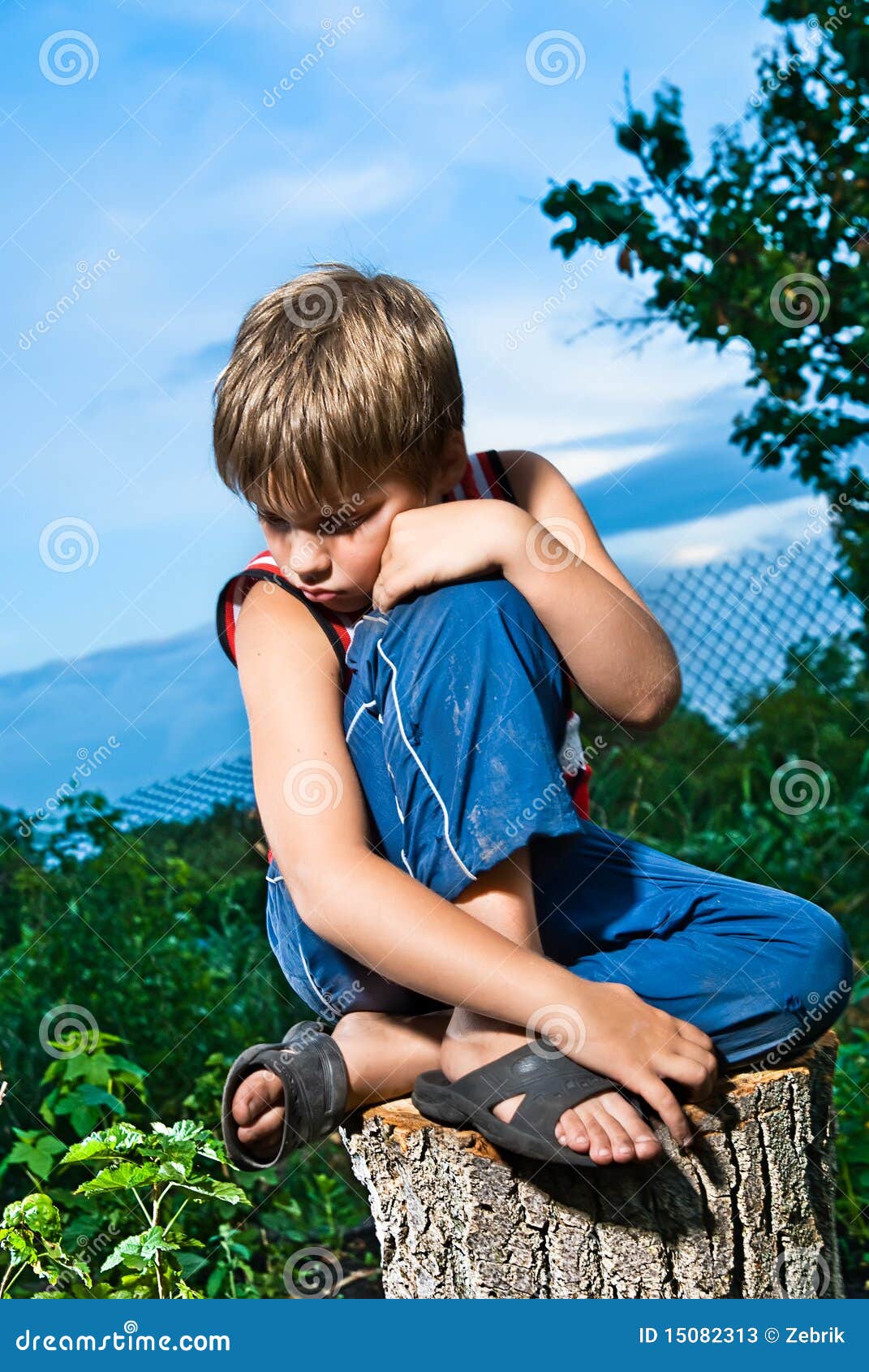 Sad Little Boy Sitting On A Stump Royalty-Free Stock Photography ...