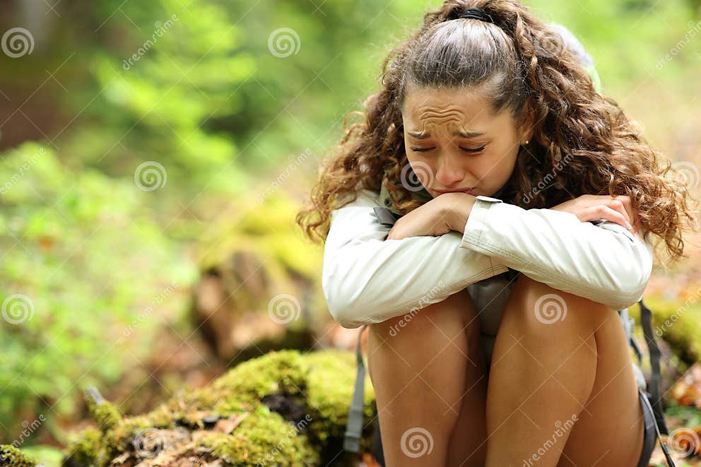 Sad Lost Hiker in a Forest Crying Alone Stock Image - Image of girl, fear: 303705519