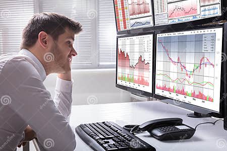 Sad Male Operator Looking at Graphs on Multiple Computer Screen Stock ...