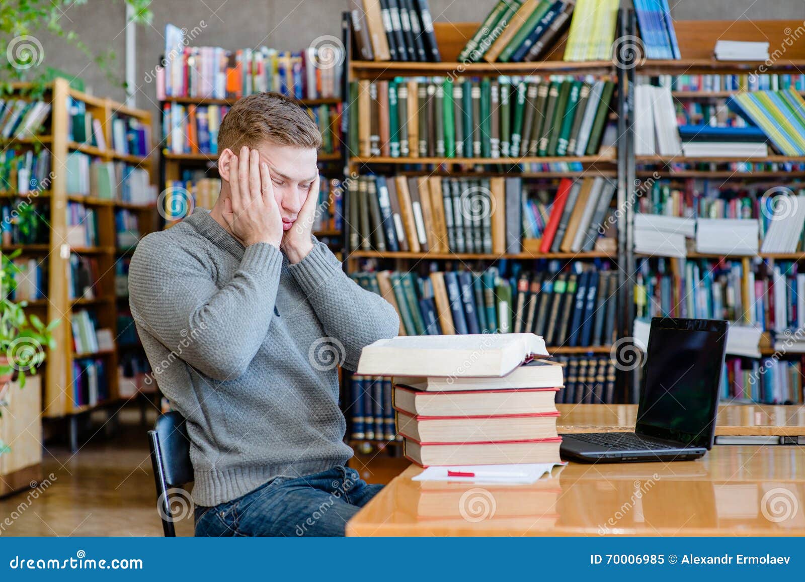 Sad Male Student in the University Library Stock Image - Image of ...