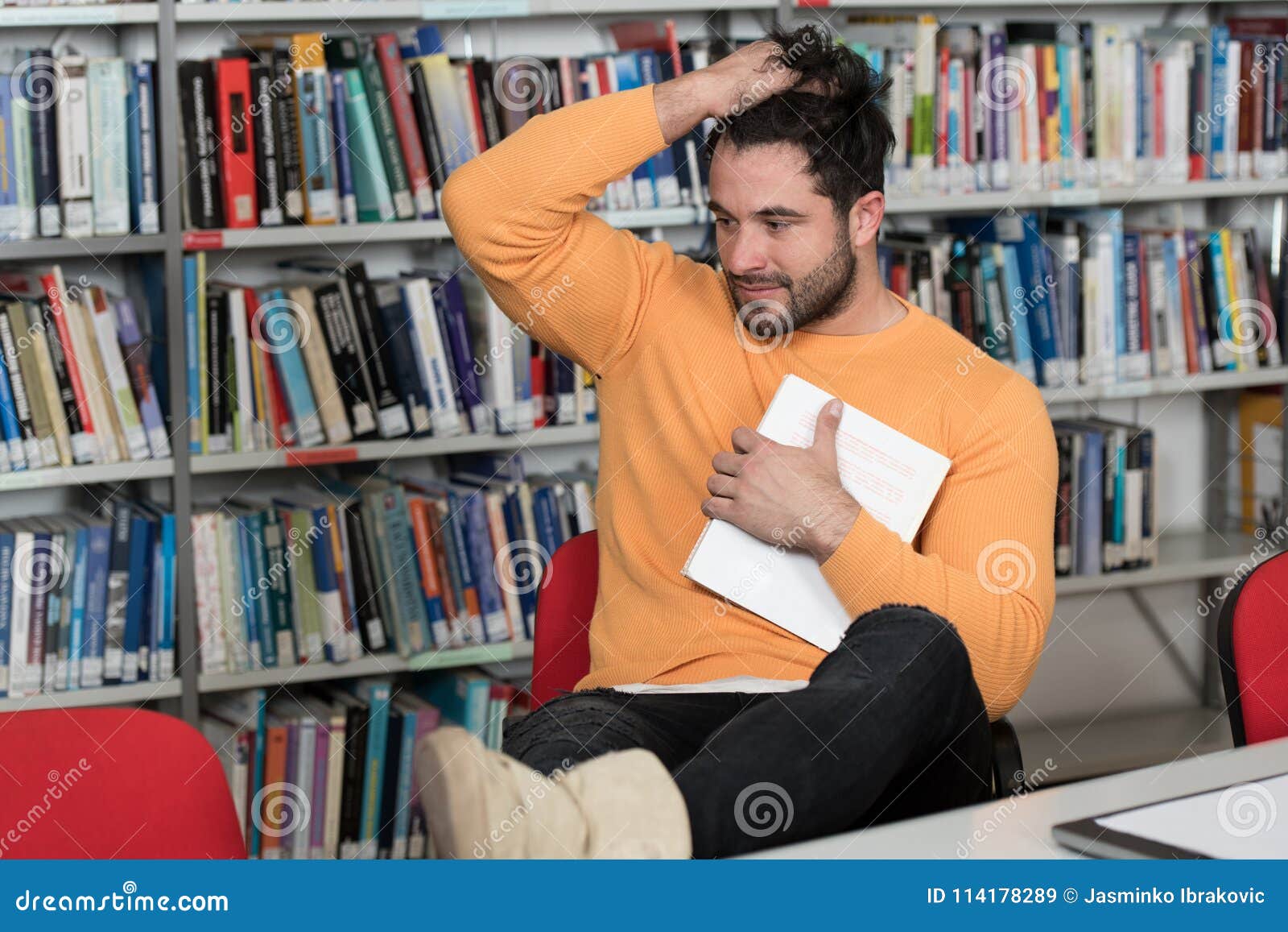 Sad Male Student in the University Library Stock Image - Image of male ...