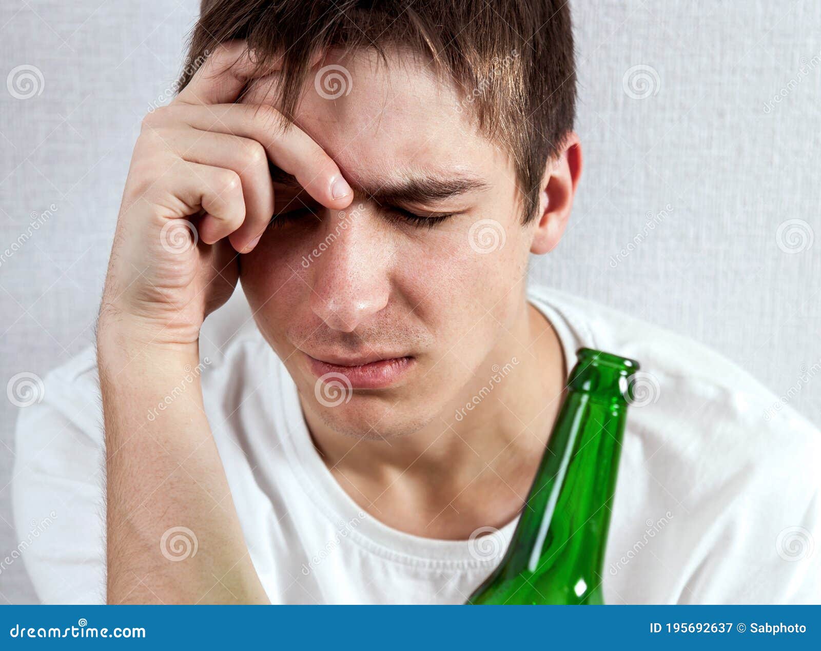 Sad Man with a Beer stock image. Image of closeup, hungover - 195692637