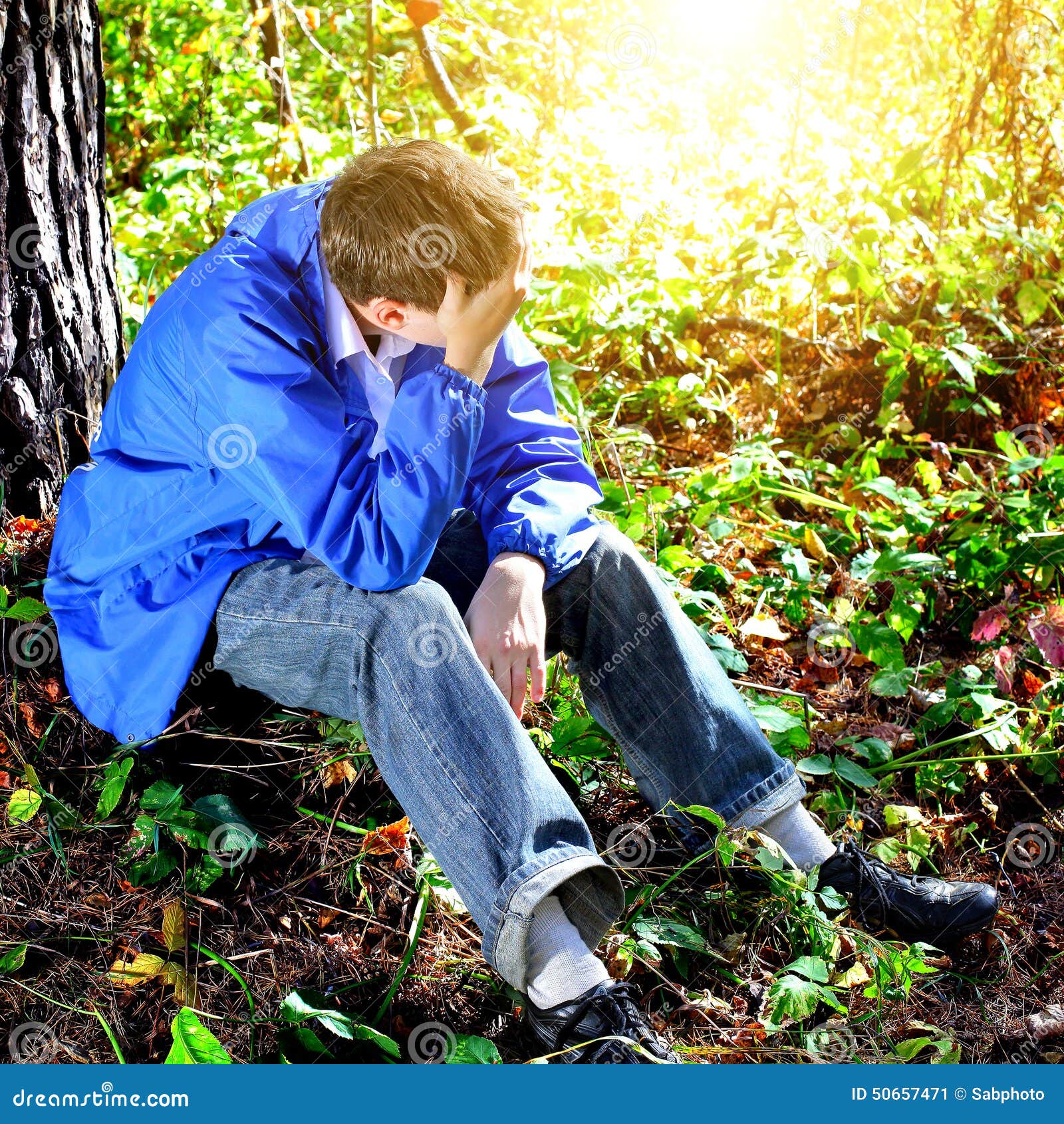 Sad Man in the Forest stock image. Image of jeans, loneliness - 50657471