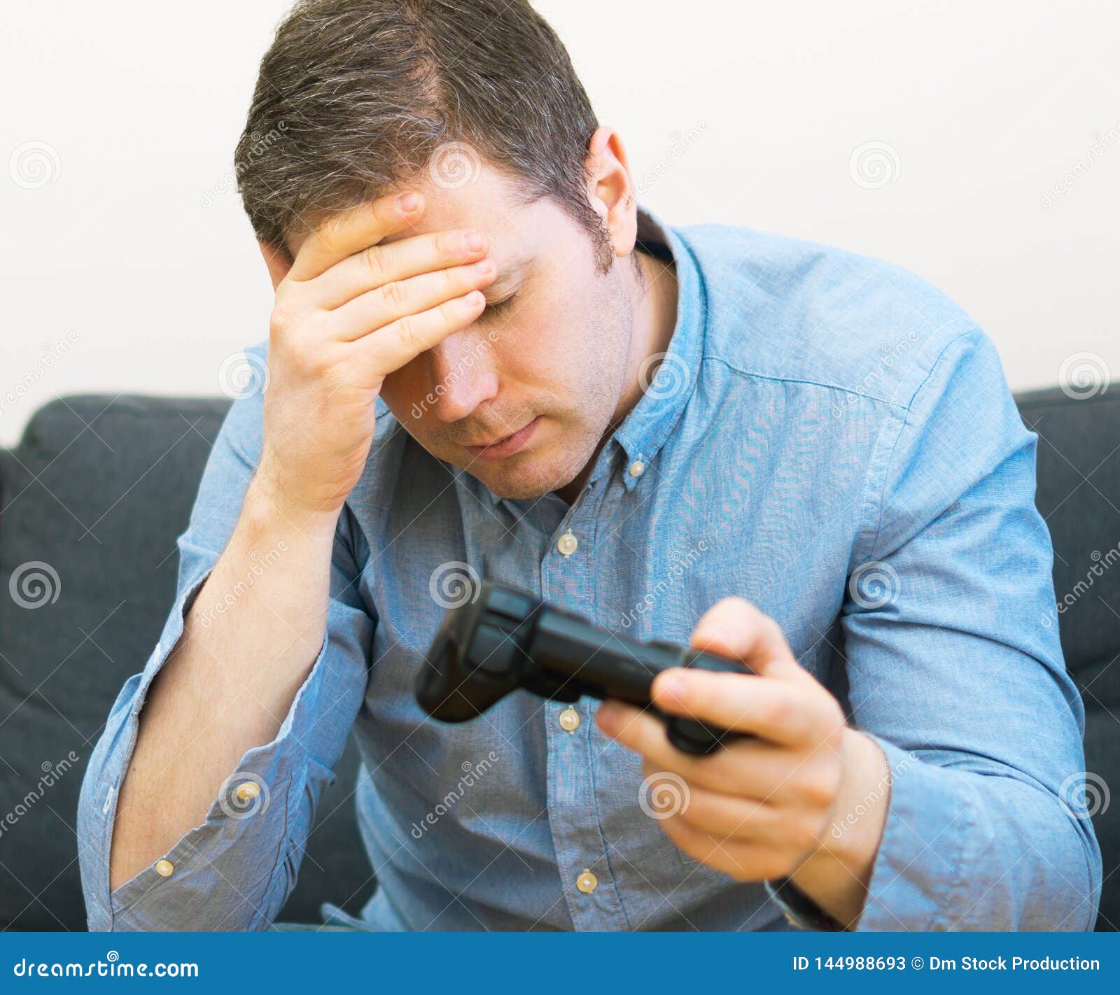 Sad man with gamepad stock image. Image of game, caucasian - 144988693