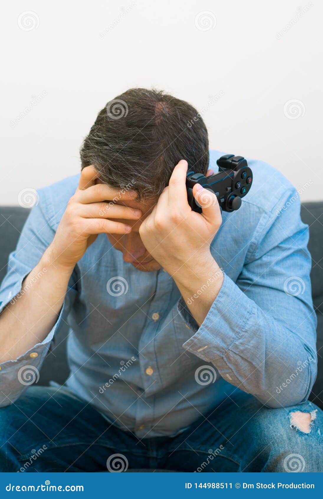 Sad man with gamepad stock image. Image of disapointed - 144988511