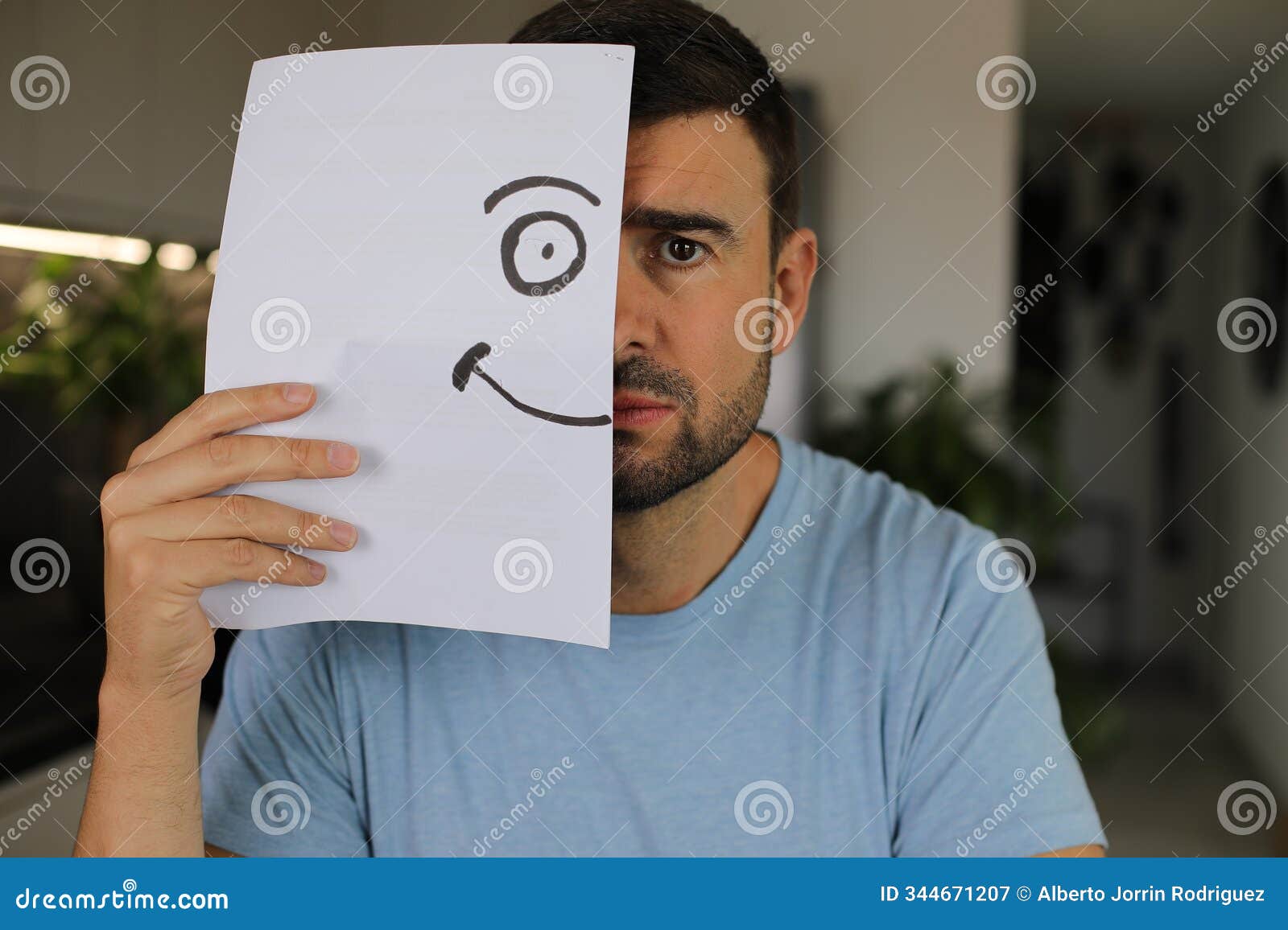 Sad man with a happy mask stock image. Image of artificial - 344671207