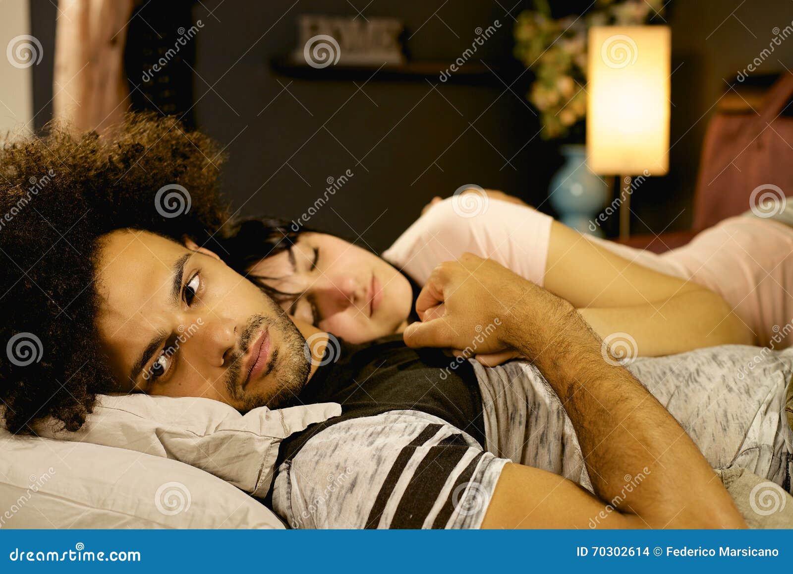 Sad Man Holding Hand of Sleeping Girlfriend Expressing Problem in ...